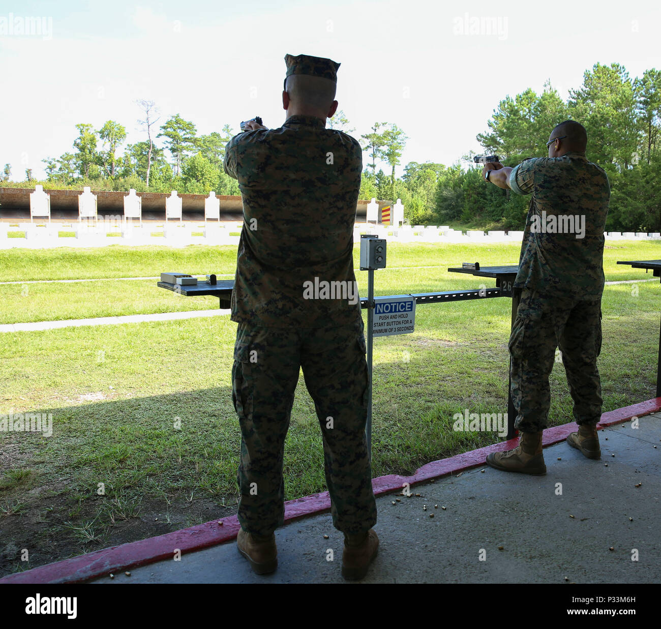 U.S. Marine Corps Lt. Col. Chris D. Hrudka, left, commanding officer ...