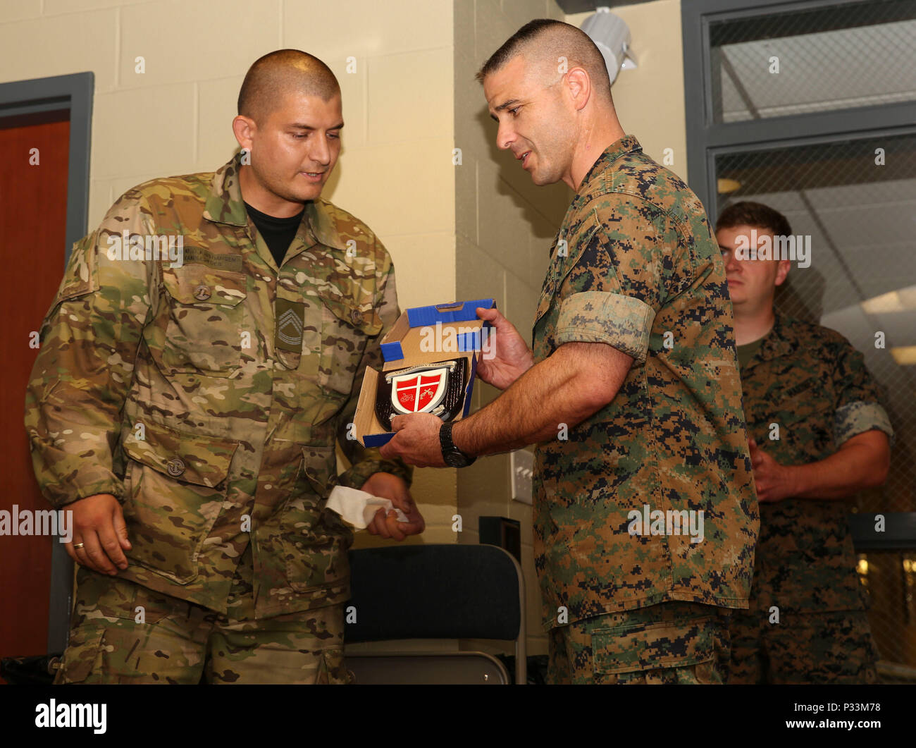 Royal Danish Army Gunnery Sgt. Jacob Panton, left, tank commander ...