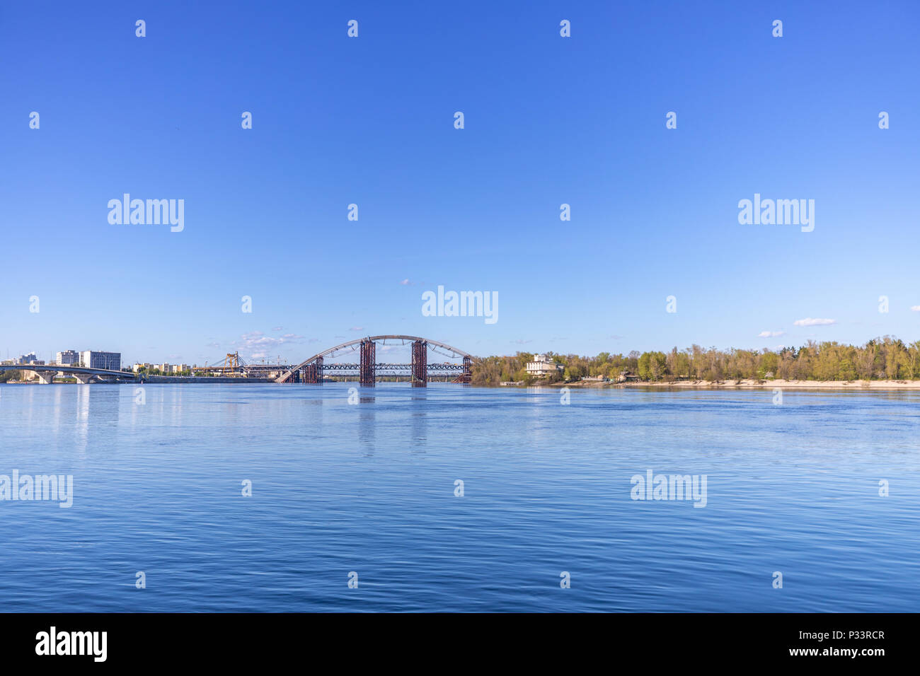 View with blue river and horizon line Stock Photo - Alamy