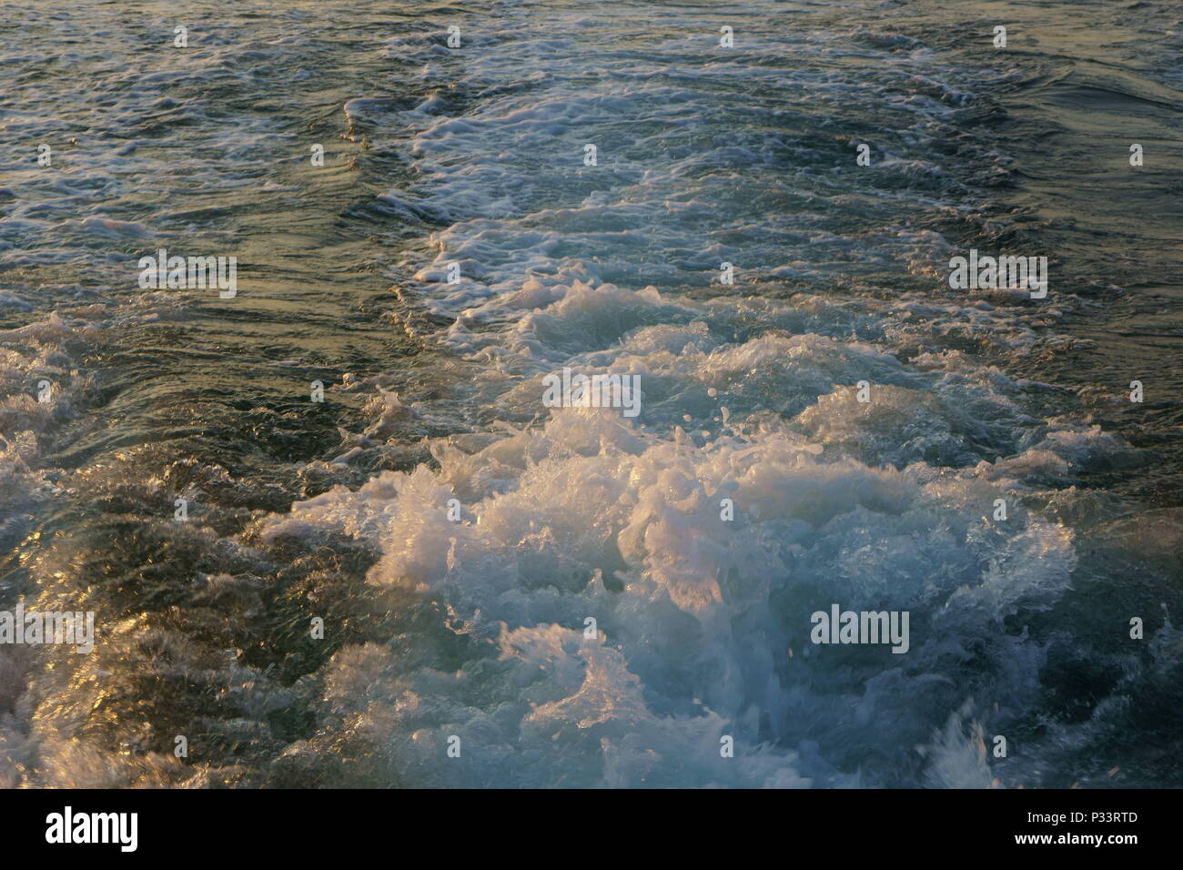 Wave in sea caused by Boat sailing Stock Photo - Alamy