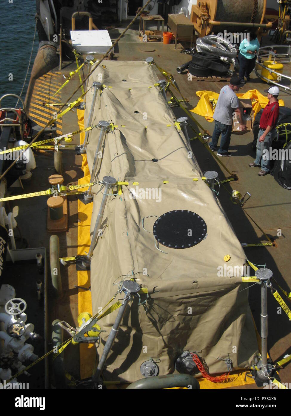 Temporary deck-mounted oily-water storage device onboard Coast Guard ...