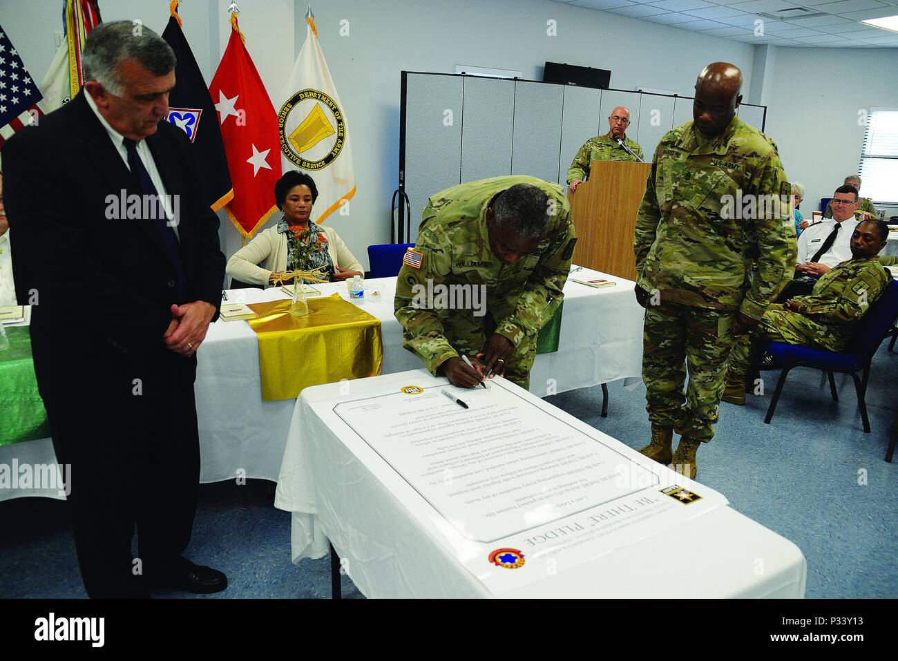 John E. Hall, deputy to the commanding general, and Command Sgt. Maj ...