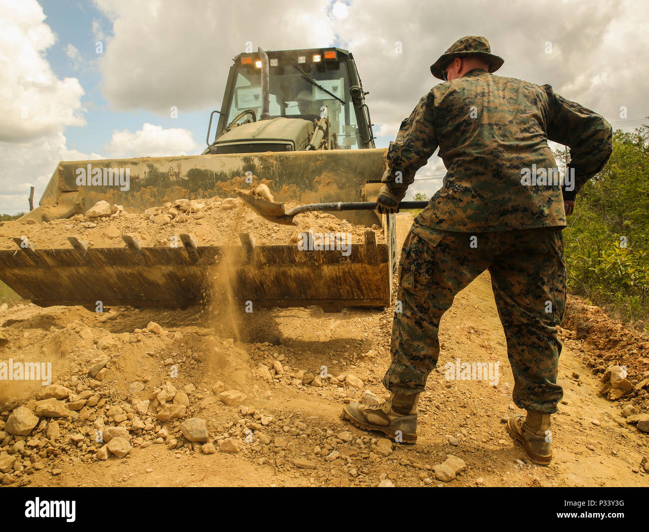 U.S. Marine Lance Cpl. Ian Fackiener, a heavy equipment operator with ...
