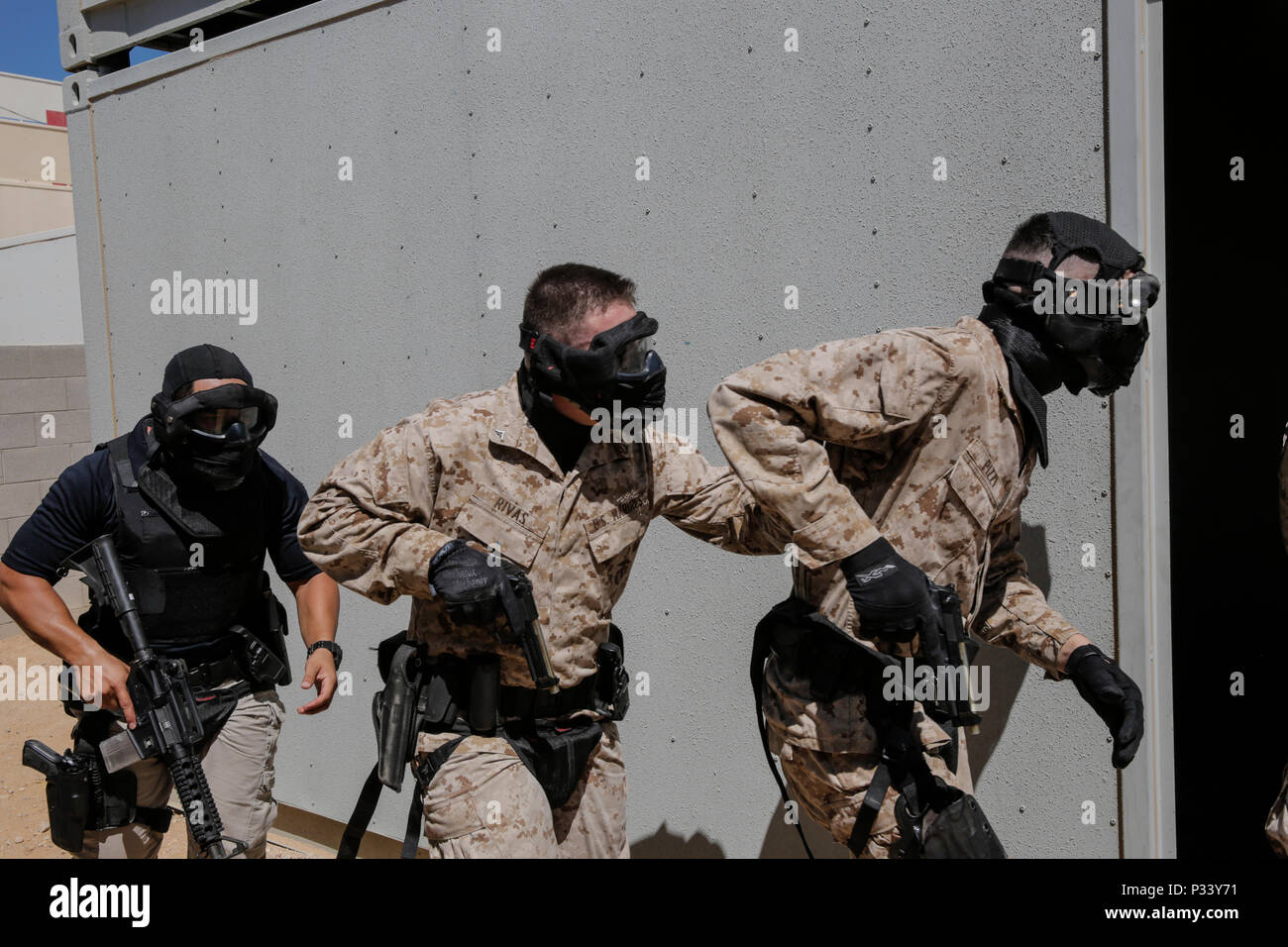 Civilians and Marines police officers from the Provost Marshal’s Office ...