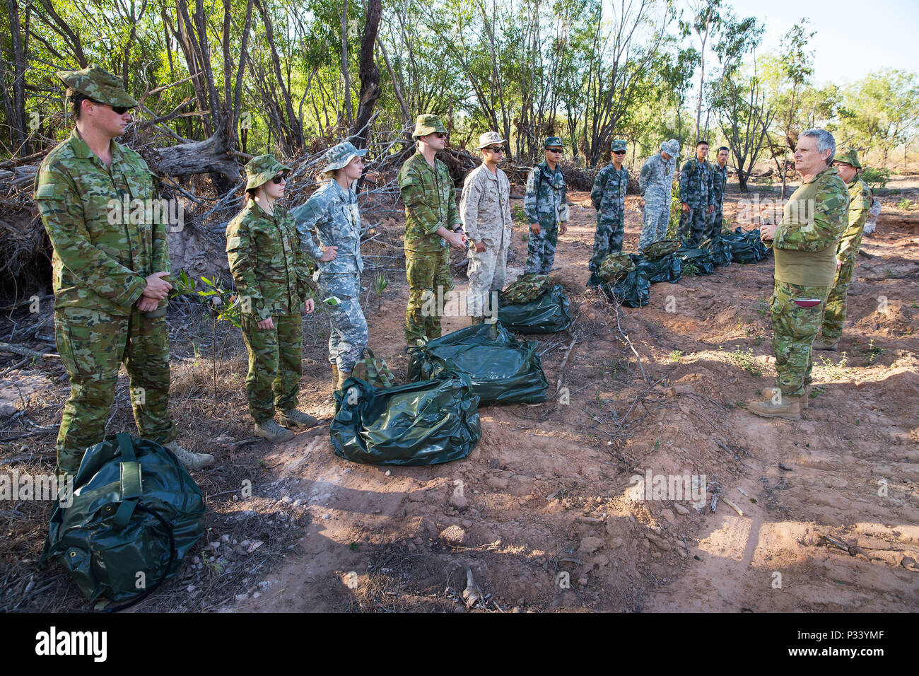 Australian Army soldier Warrant Officer Class Two Lee Symons (right ...