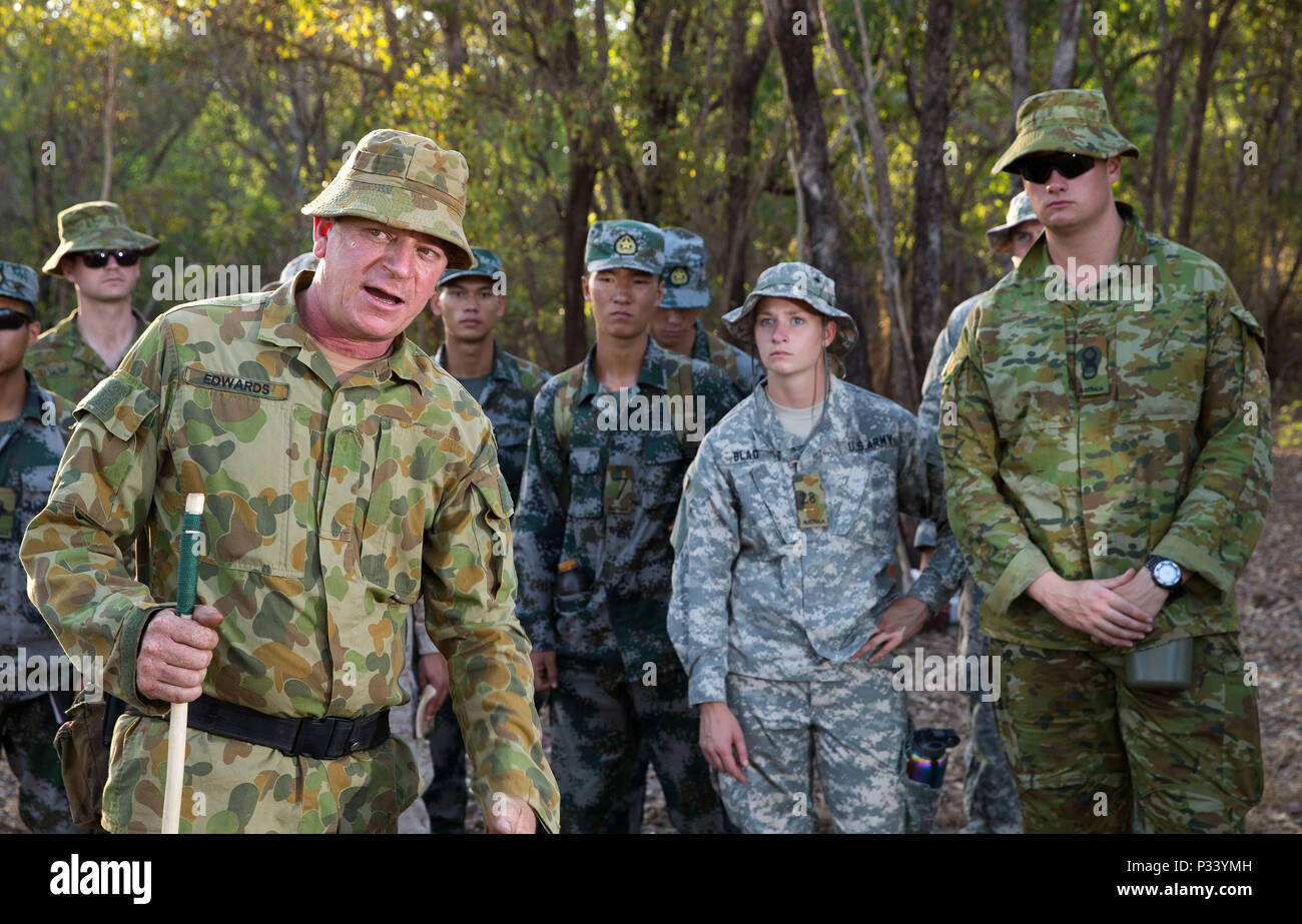 Australian Army soldier Sergeant Martin Edwards (left) briefs ...