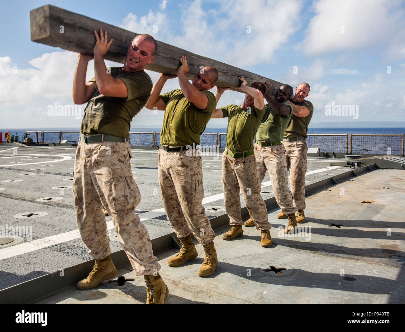PACIFIC OCEAN – U.S. Marines with Task Force Koa Moana lifts a log ...