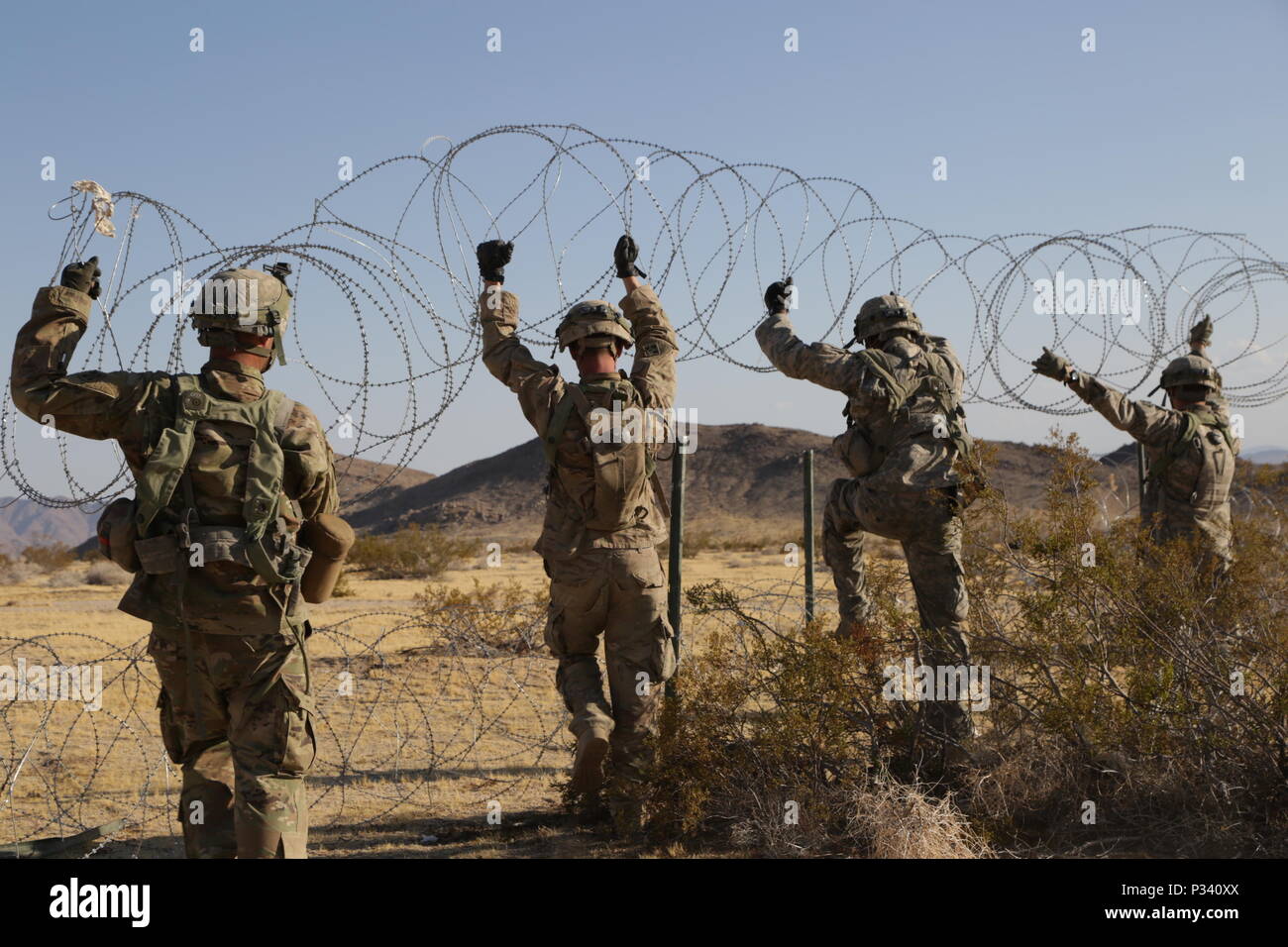 U.S. Soldiers assigned to 588th Engineer Battalion sets up obstacles ...