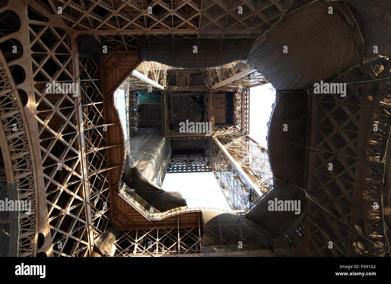 Looking up through the bottom of the Eiffel Tower, Paris, France ...