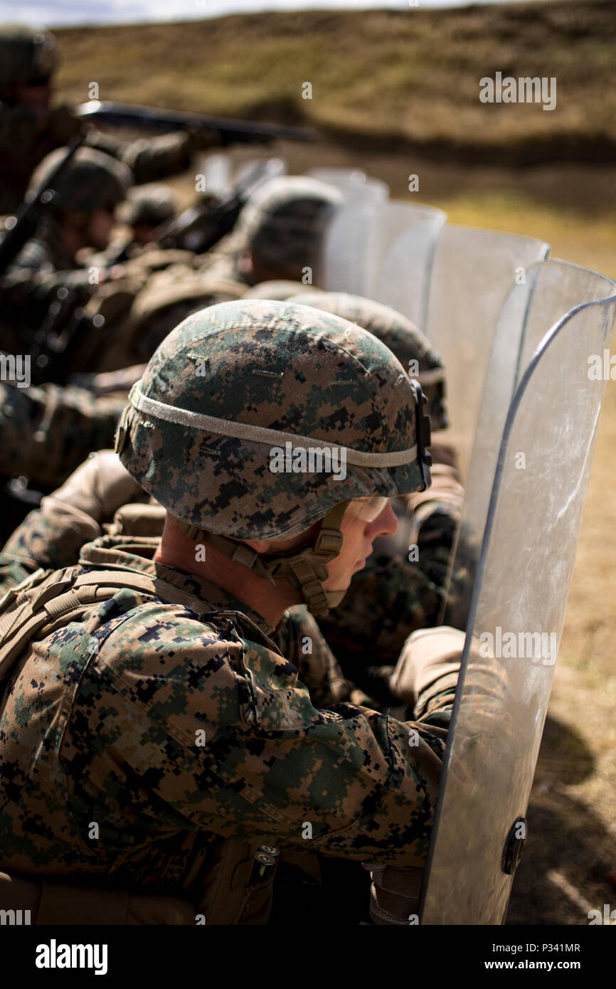 U.S. Marines train to use riot gear, which provides an escalation of ...