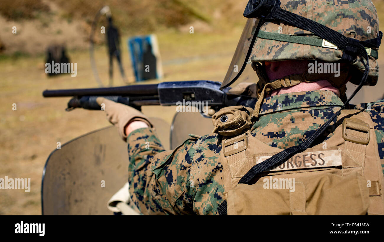 U.S. Marines rehearse using a Mossberg 500 shotgun loaded with rubber ...