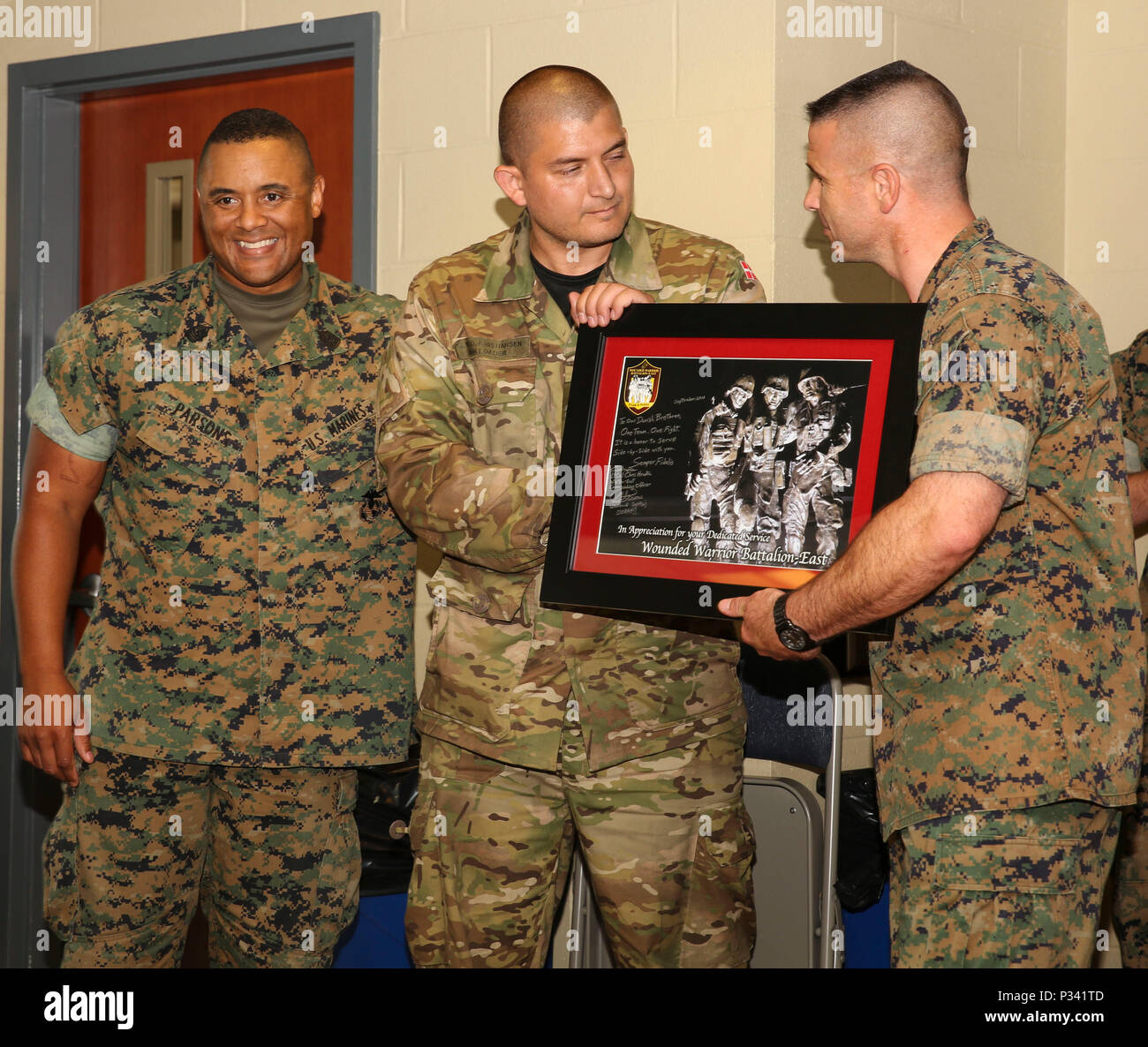 U.S. Marine Corps Lt. Col. Chris D. Hrudka, right, commanding officer ...