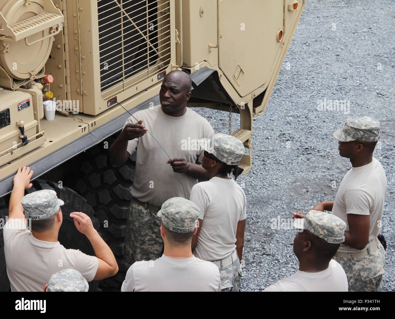 Staff Sgt. James Weathers, top center, motor transport operator, shows ...