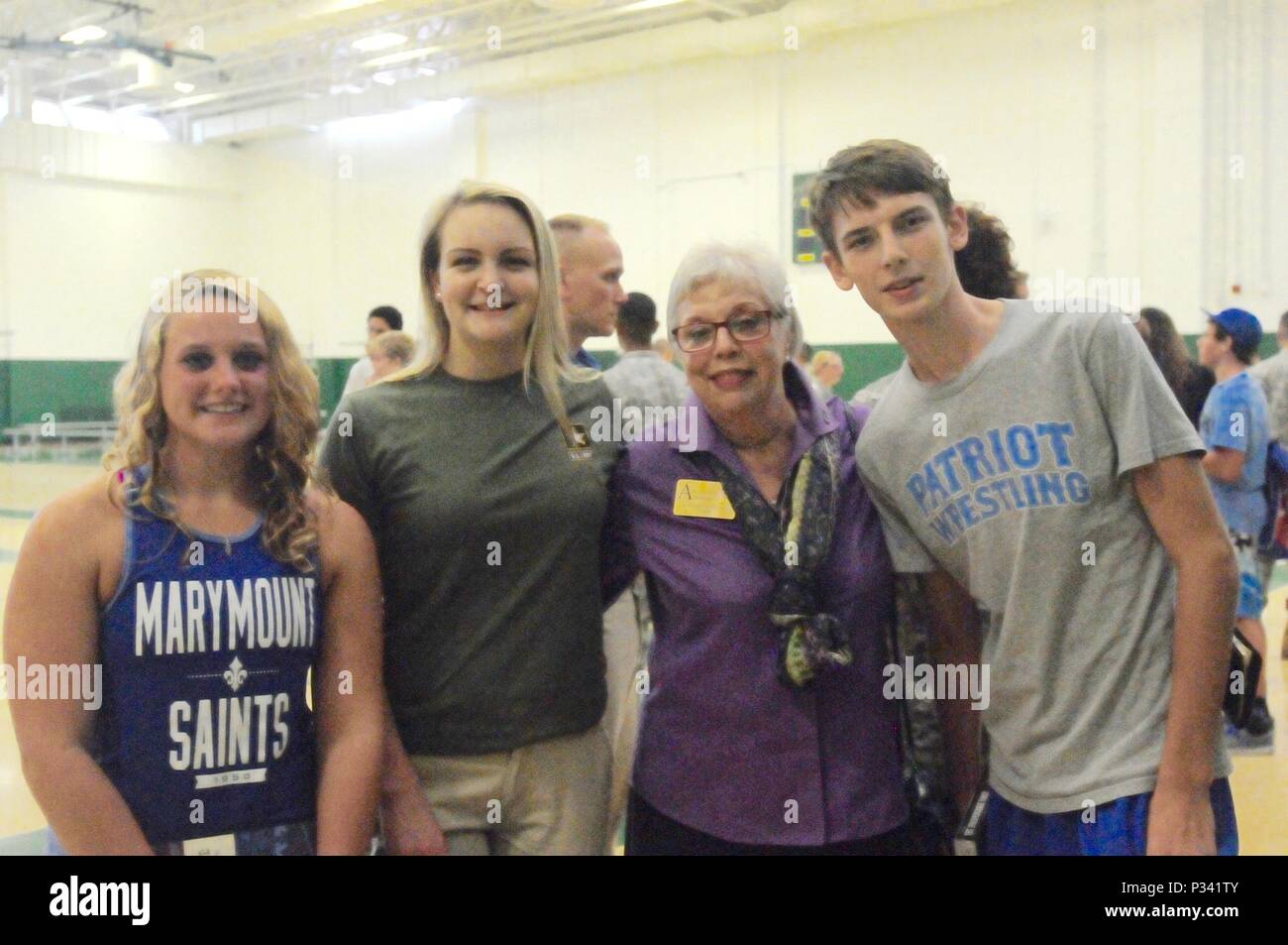 Army Reserve Ambassador Isabelle Slifer poses with three Minuteman ...