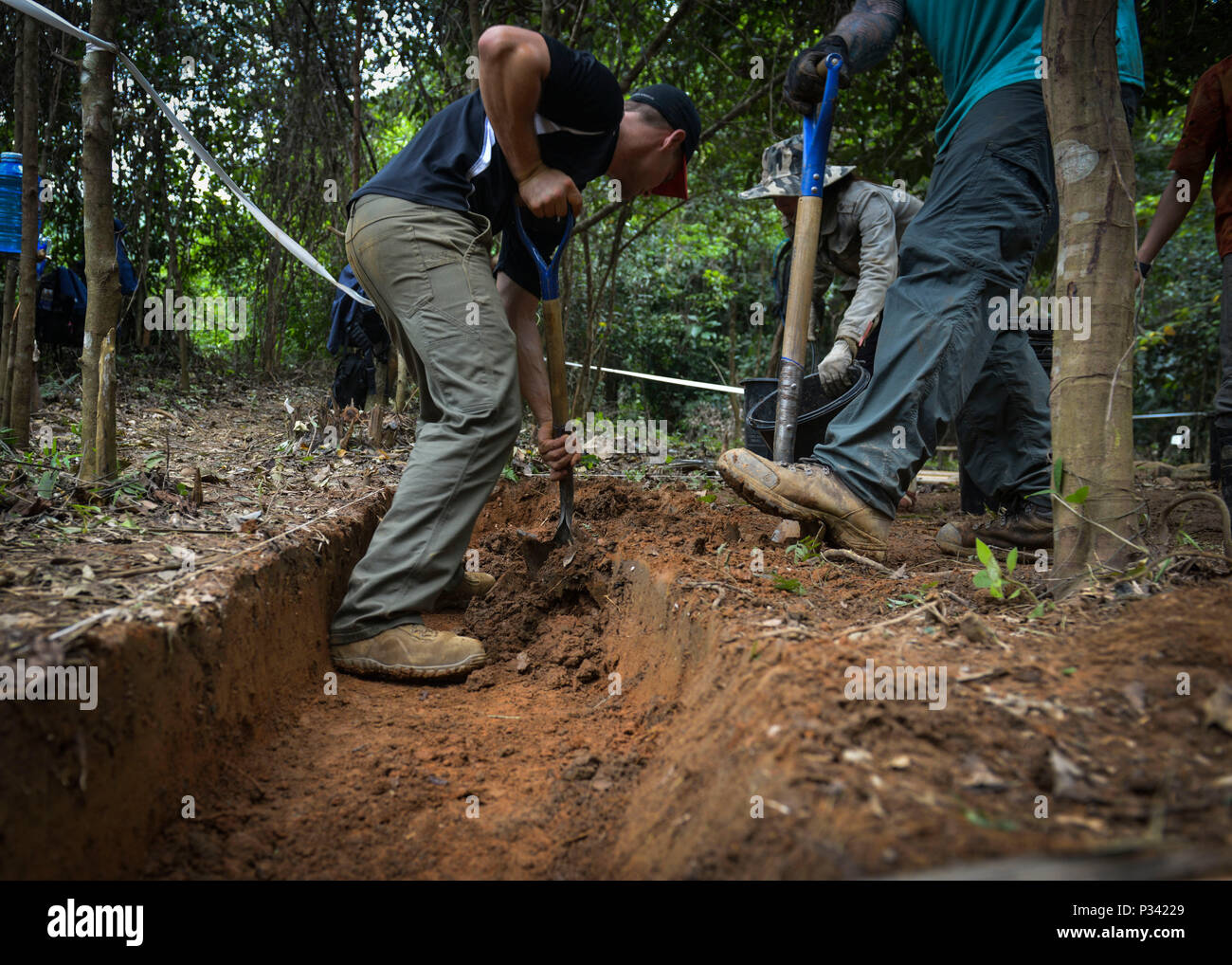 U.S. Navy Petty Officer 2nd Class Jonathan Walsh, recovery noncommissioned officer, helps ...