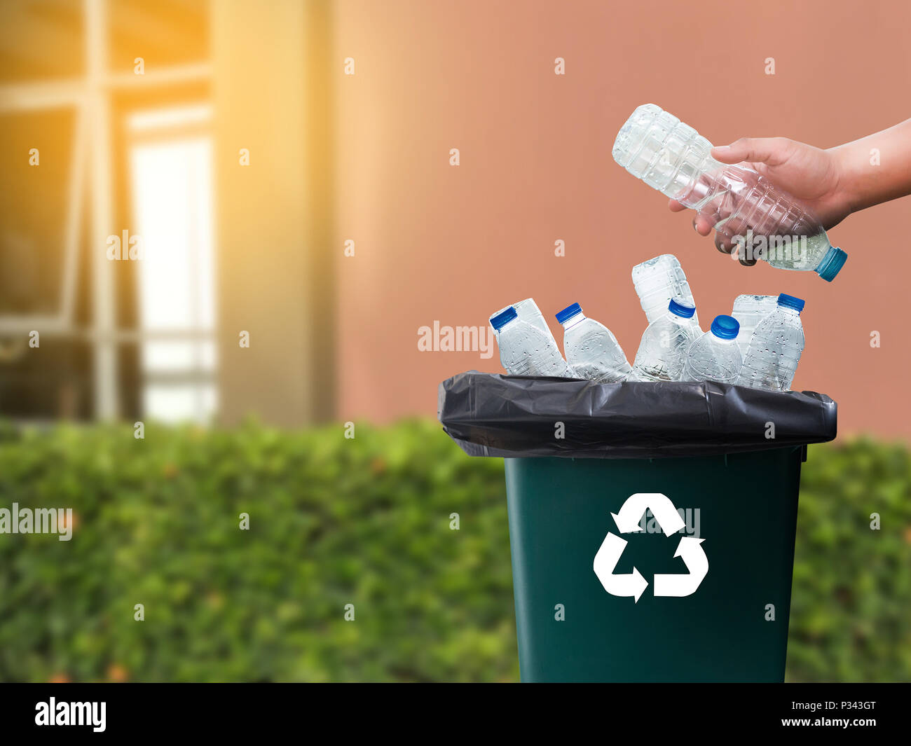 man hand putting plastic reuse for recycling concept environmental ...