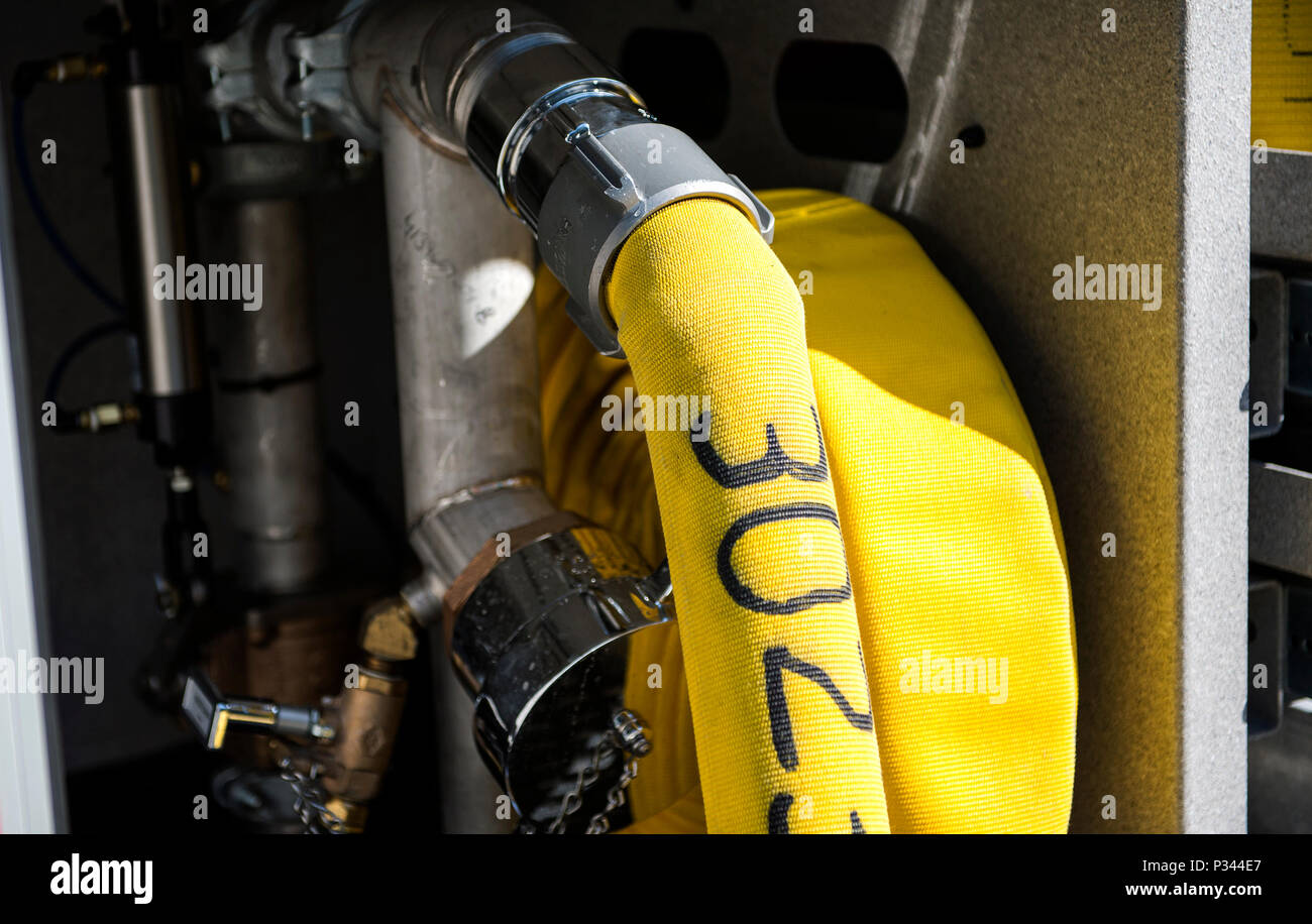 A hose allows water to flow into a depleted fire truck during a joint ...