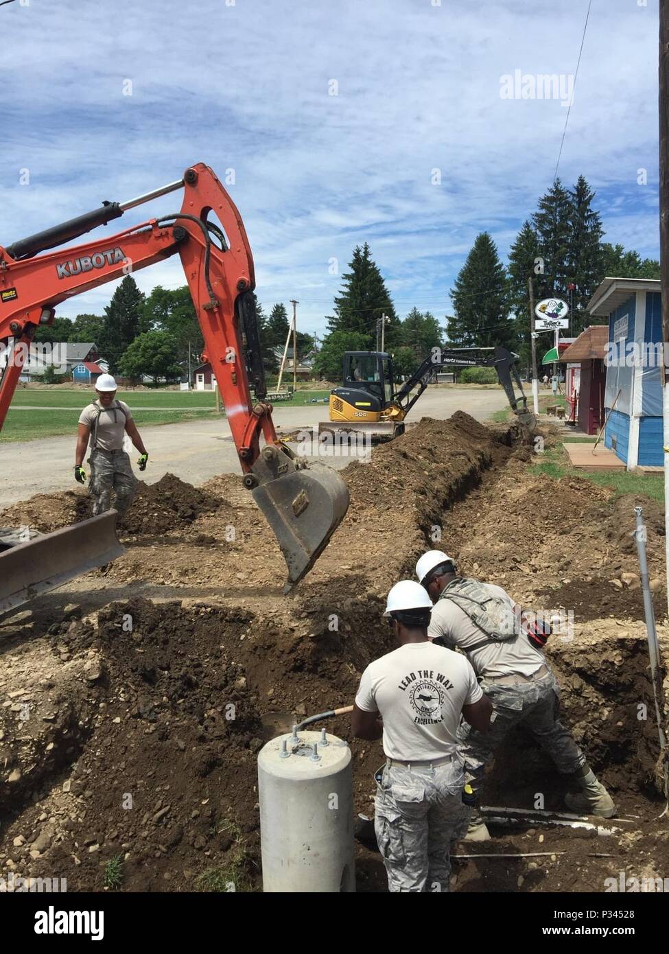 Reservists carefully inspect an area on Chenango County fairgrounds in ...