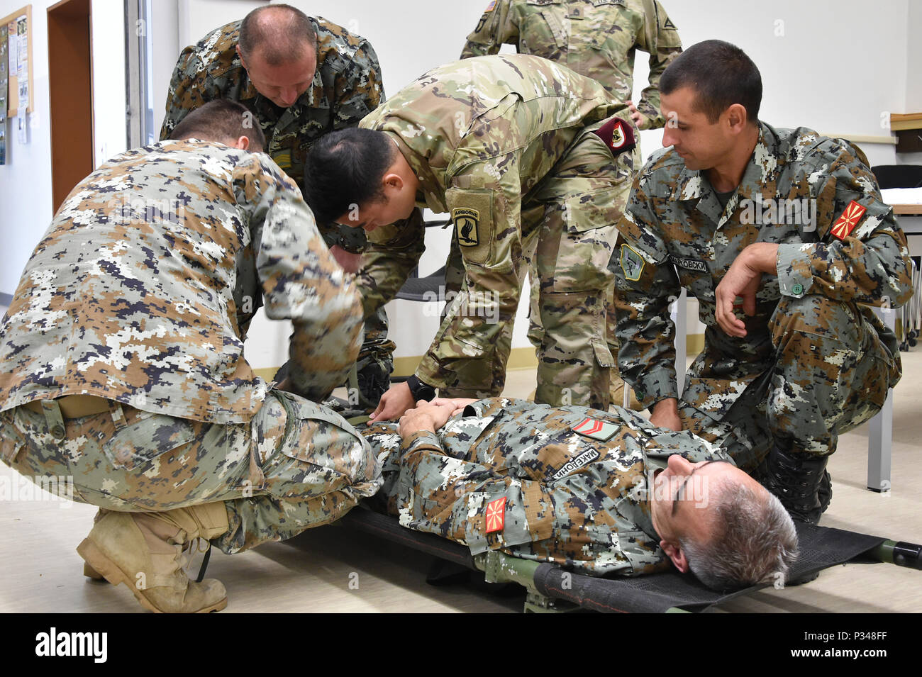 U.S. Army Staff Sgt. Stephen Pyon, center, assigned to 1st Squadron ...