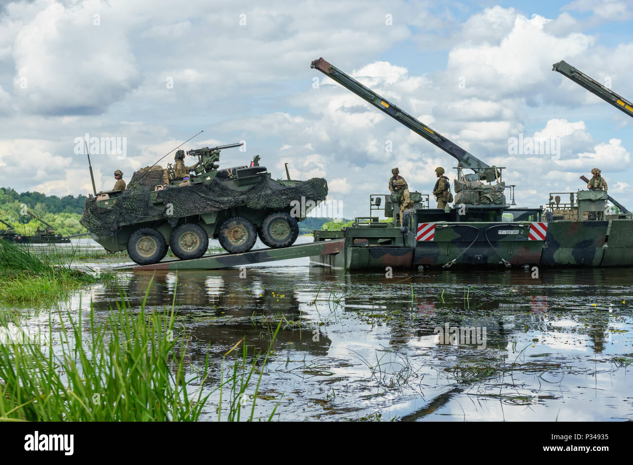 A 2d Cavalry Regiment Stryker combat vehicle boards a German M3 ...