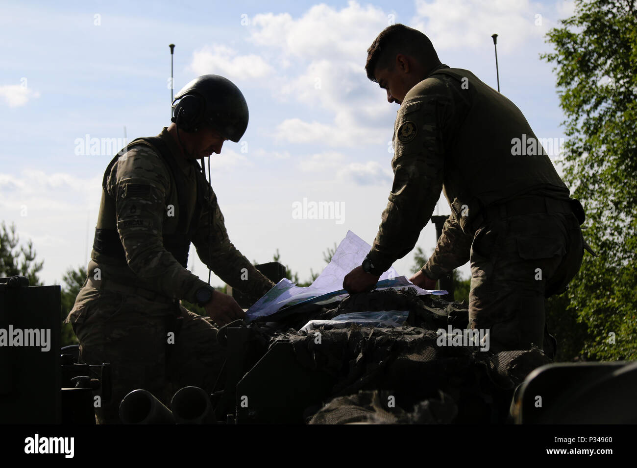 U.S. Soldiers with 1st Squadron, 2nd Cavalry Regiment, plan operations ...