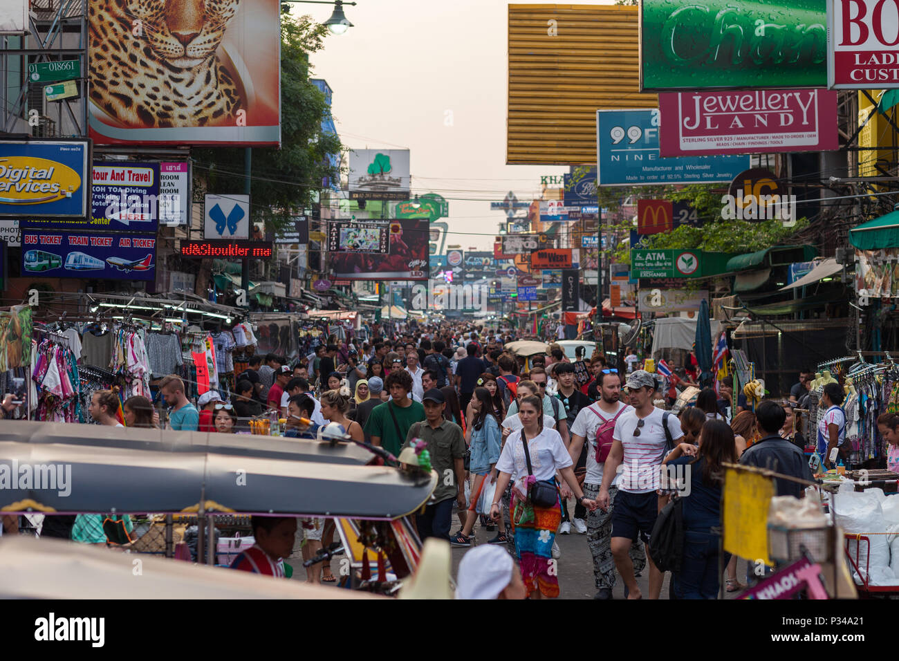 Tourists walk along commercial hi-res stock photography and images - Alamy