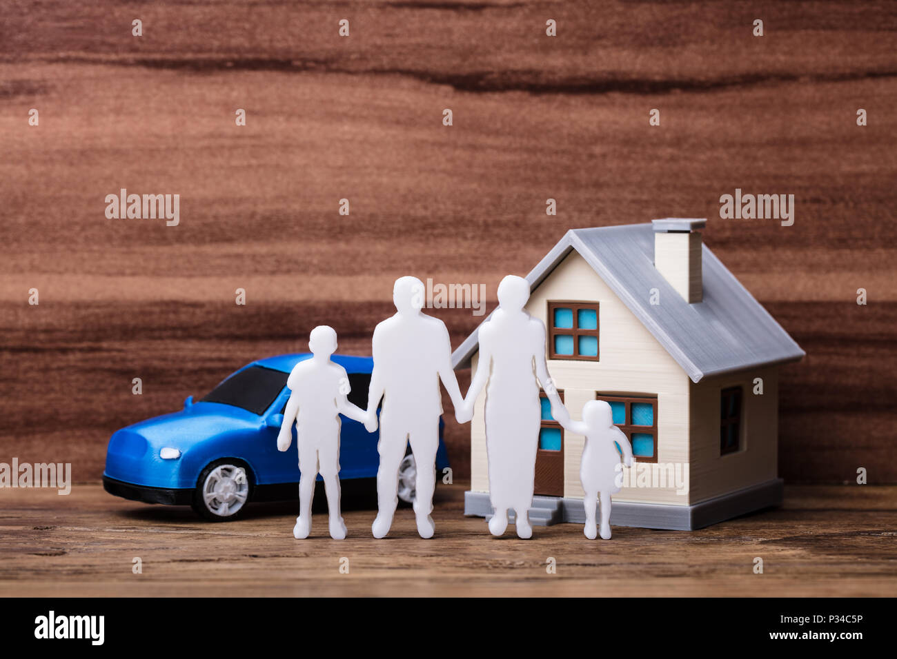 Human Figures Standing In Front Of House And Blue Car On Wooden Plank ...