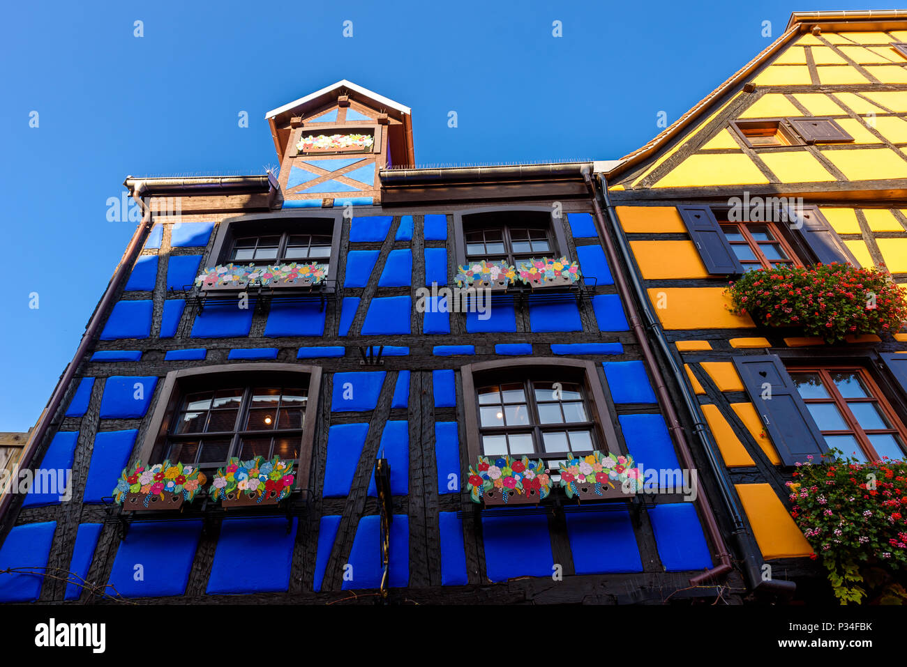 Beautiful village Riquewihr with historic buildings and colorful houses ...