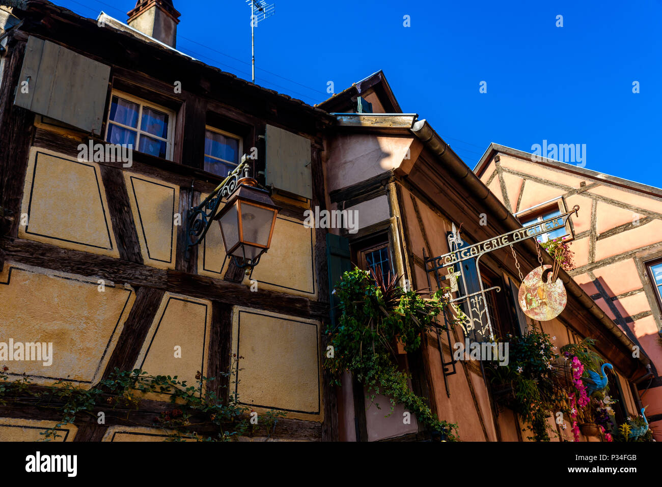 Beautiful village Riquewihr with historic buildings and colorful houses ...
