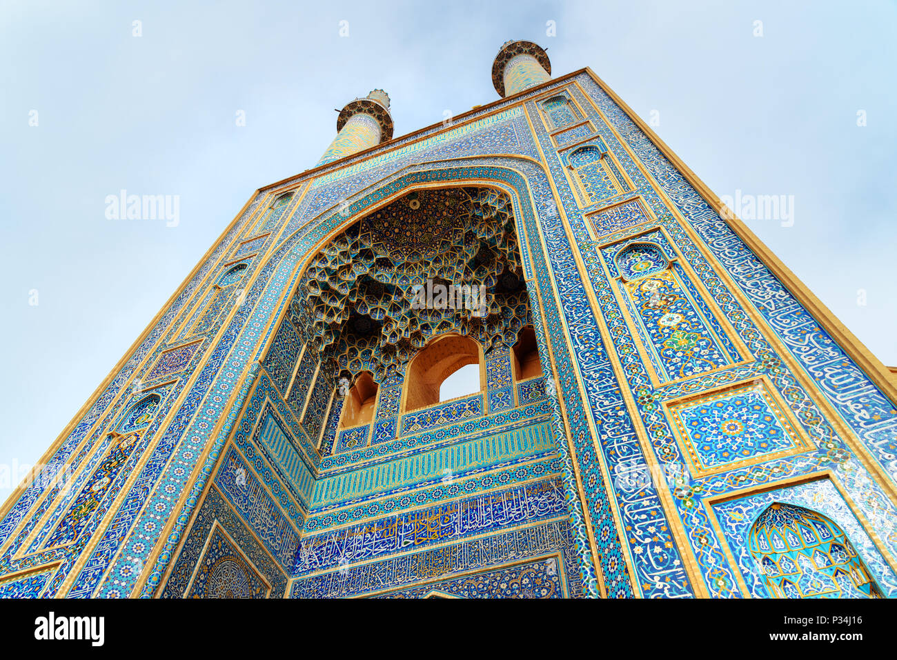 Jameh Mosque of Yazd. Entrance decorited of tile, flanked by two 48m ...