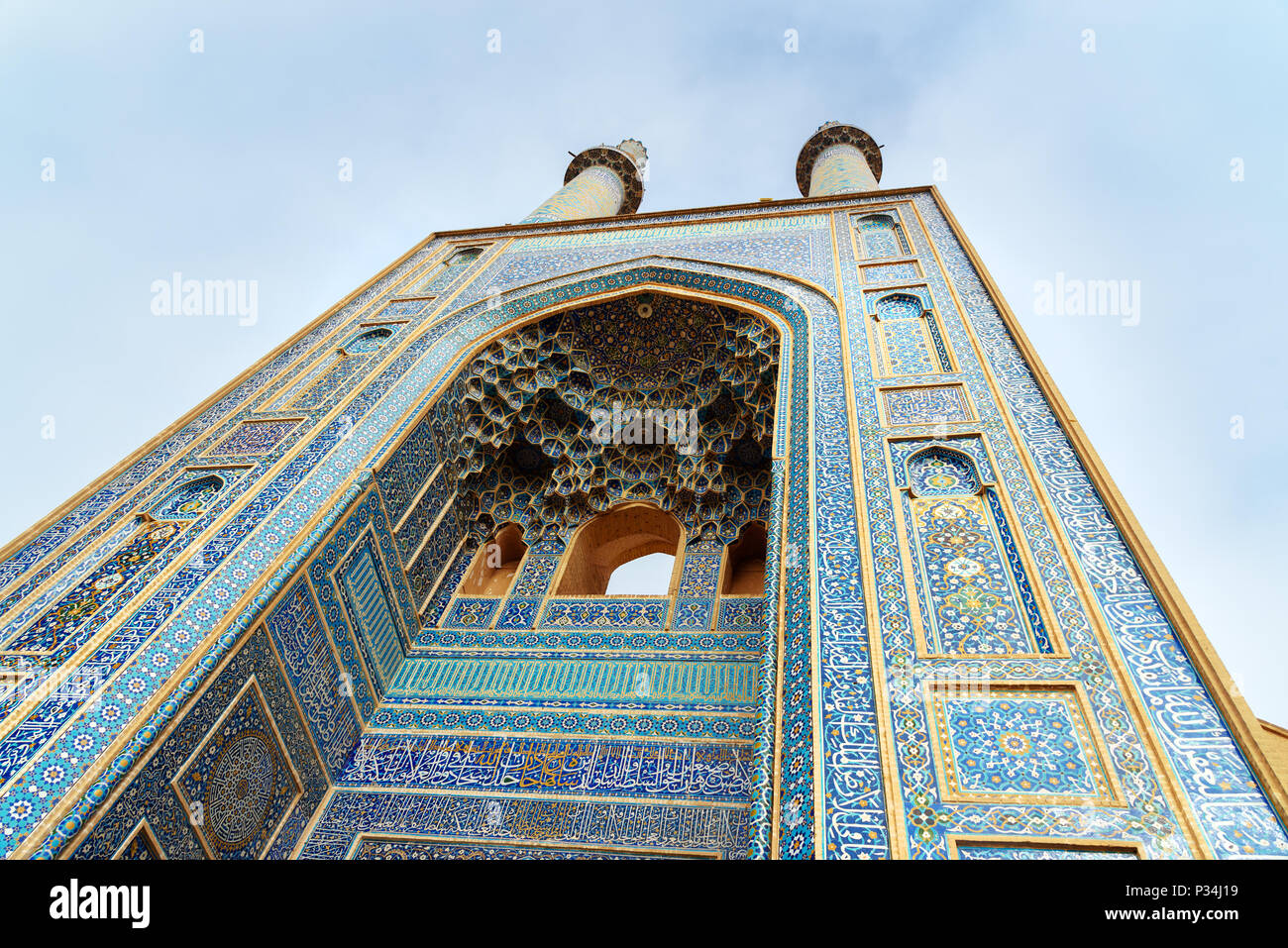 Jameh Mosque of Yazd. Entrance decorited of tile, flanked by two 48m ...