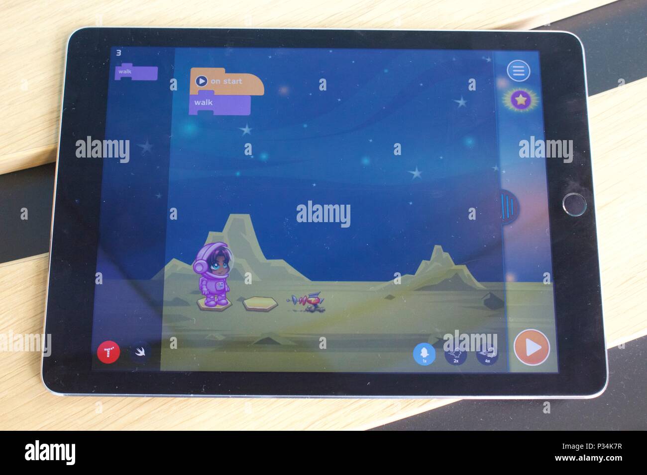 Tynker: Coding for Kids app on an Ipad Air, displaying the drag and ...