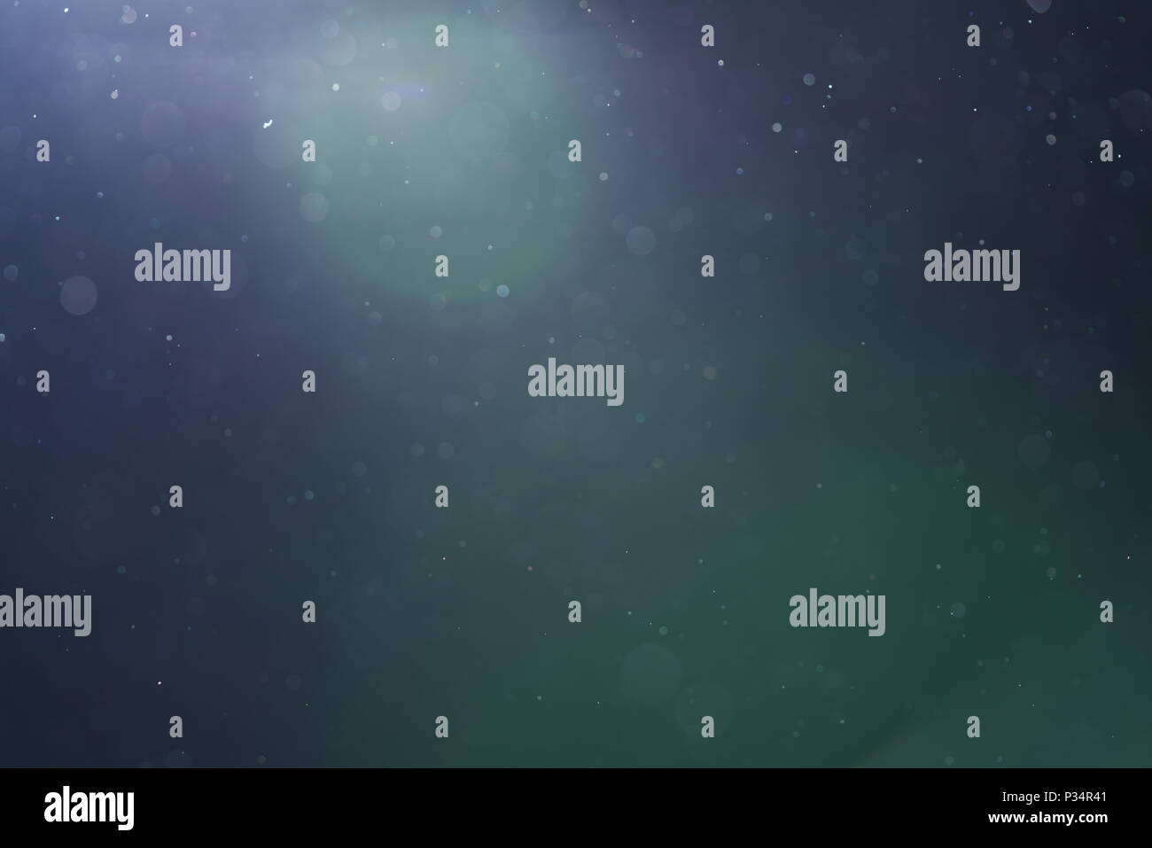 backlit real dust particles with lens flare, abstract background Stock ...