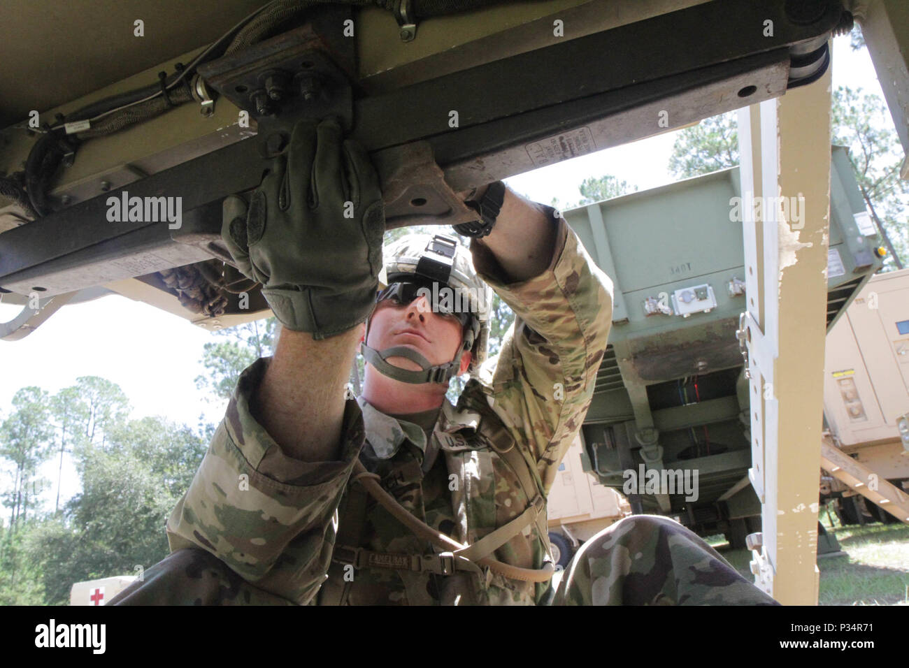 Spc. Timothy Lapach, a multichannel transmission systems operator ...