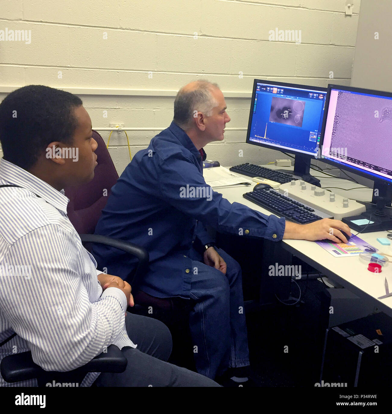 Matthew Muschett, left, getting hands-on training from Benet ...