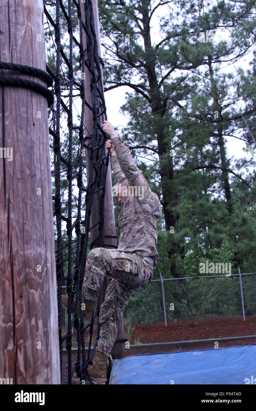 U.S. Army Reserve warrior climbs down tower obstacle as part of the ...