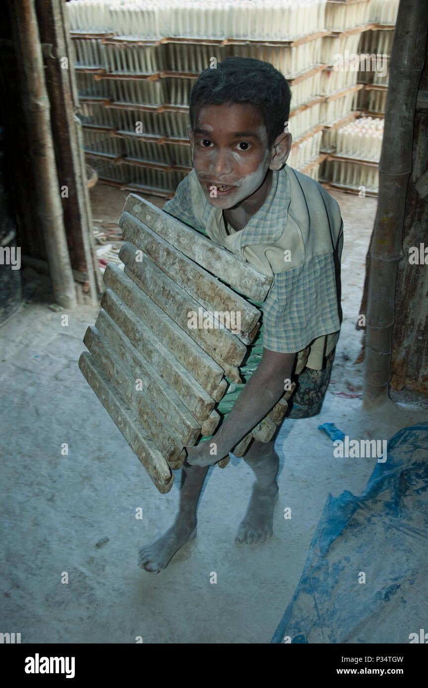 Children working child labour carrying hi-res stock photography and ...