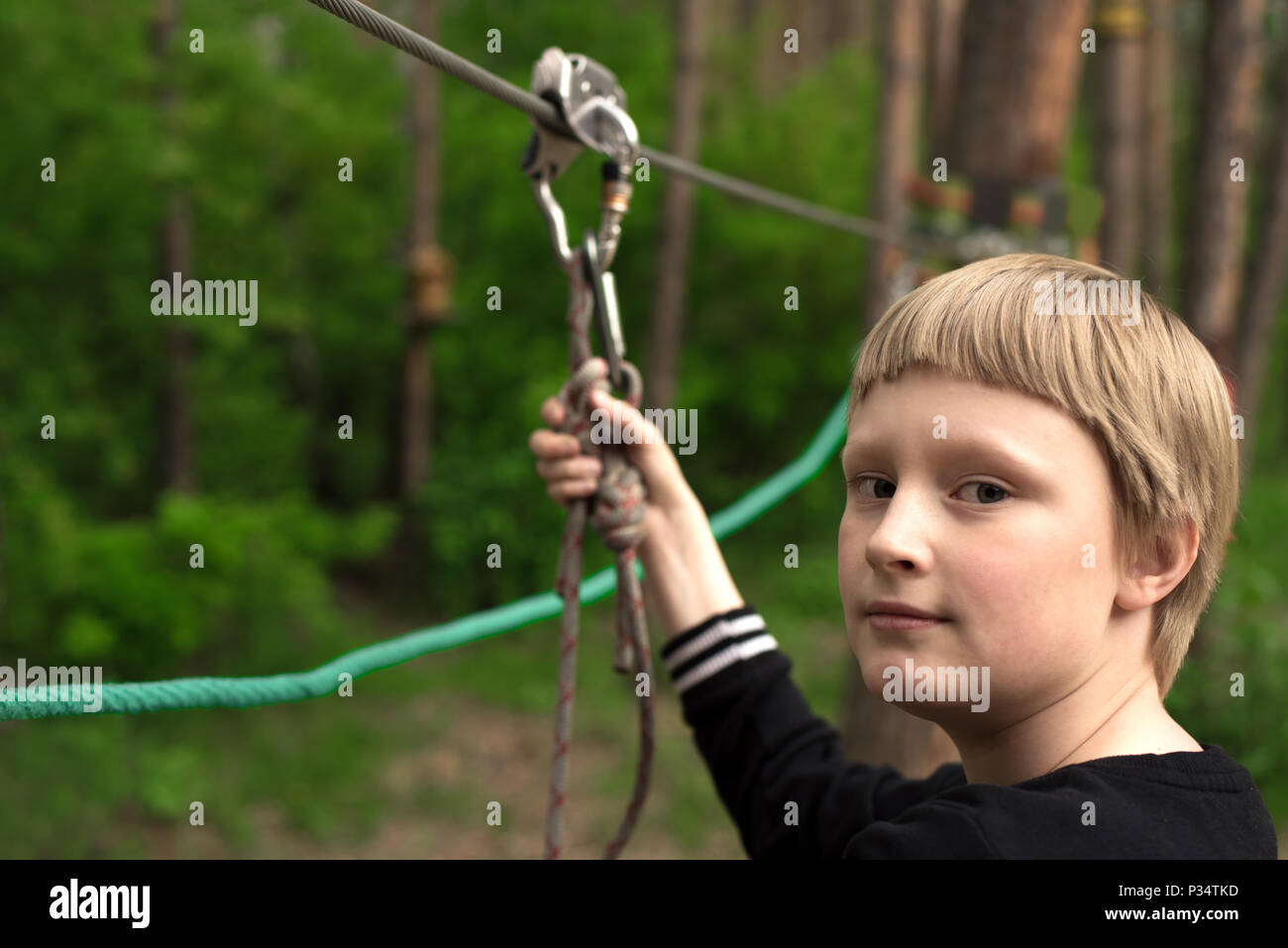 Boy on zipline hi-res stock photography and images - Alamy