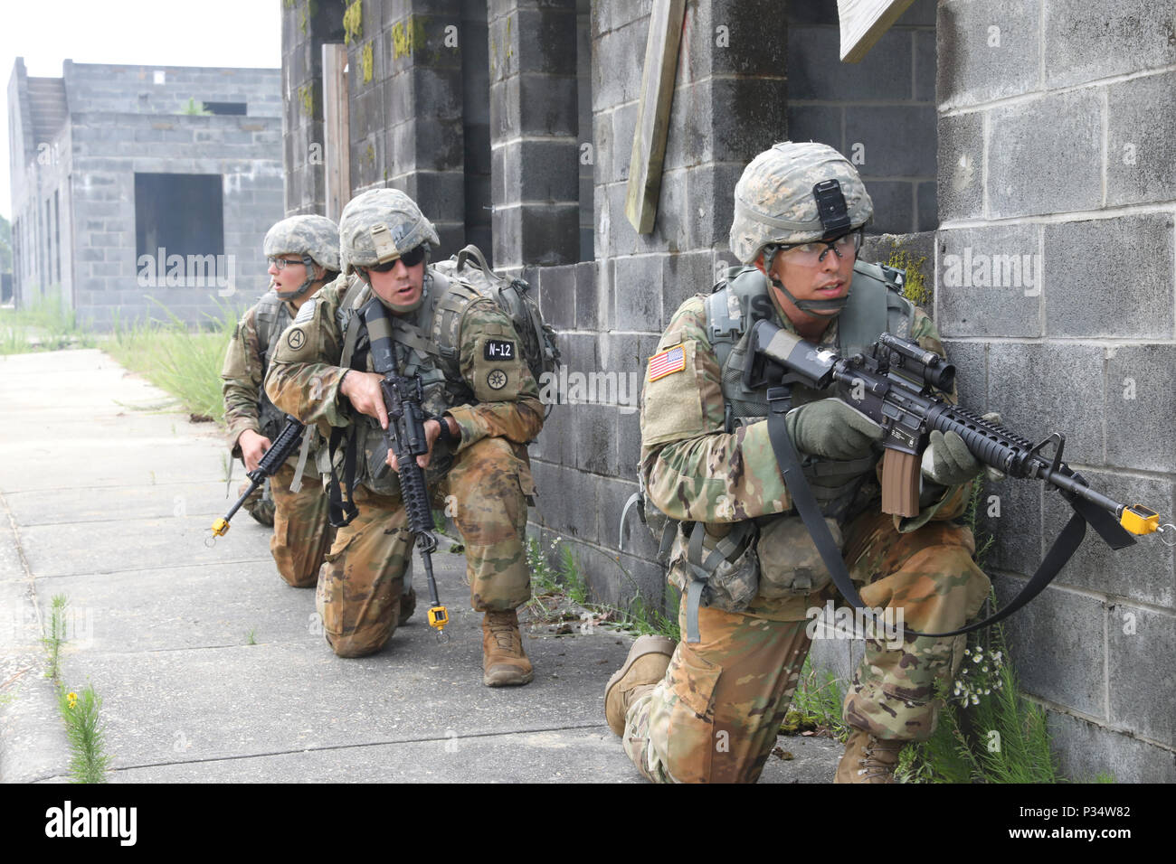 U.S. Army Reserve Sgt. Michael Mangan (middle), a chemical equipment ...