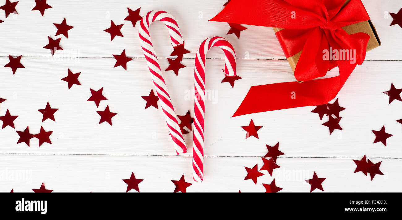 Christmas candy cane on white wood background, Christmas decors red ...