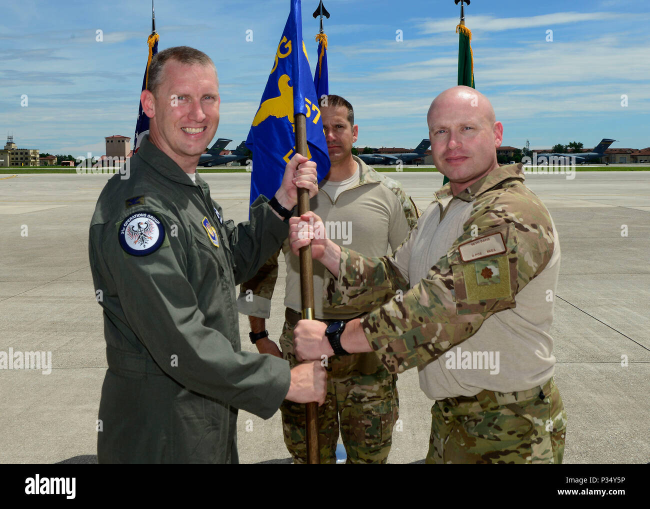 Col. Richard Nelson, 31st Operations Group commander, passes the guidon ...