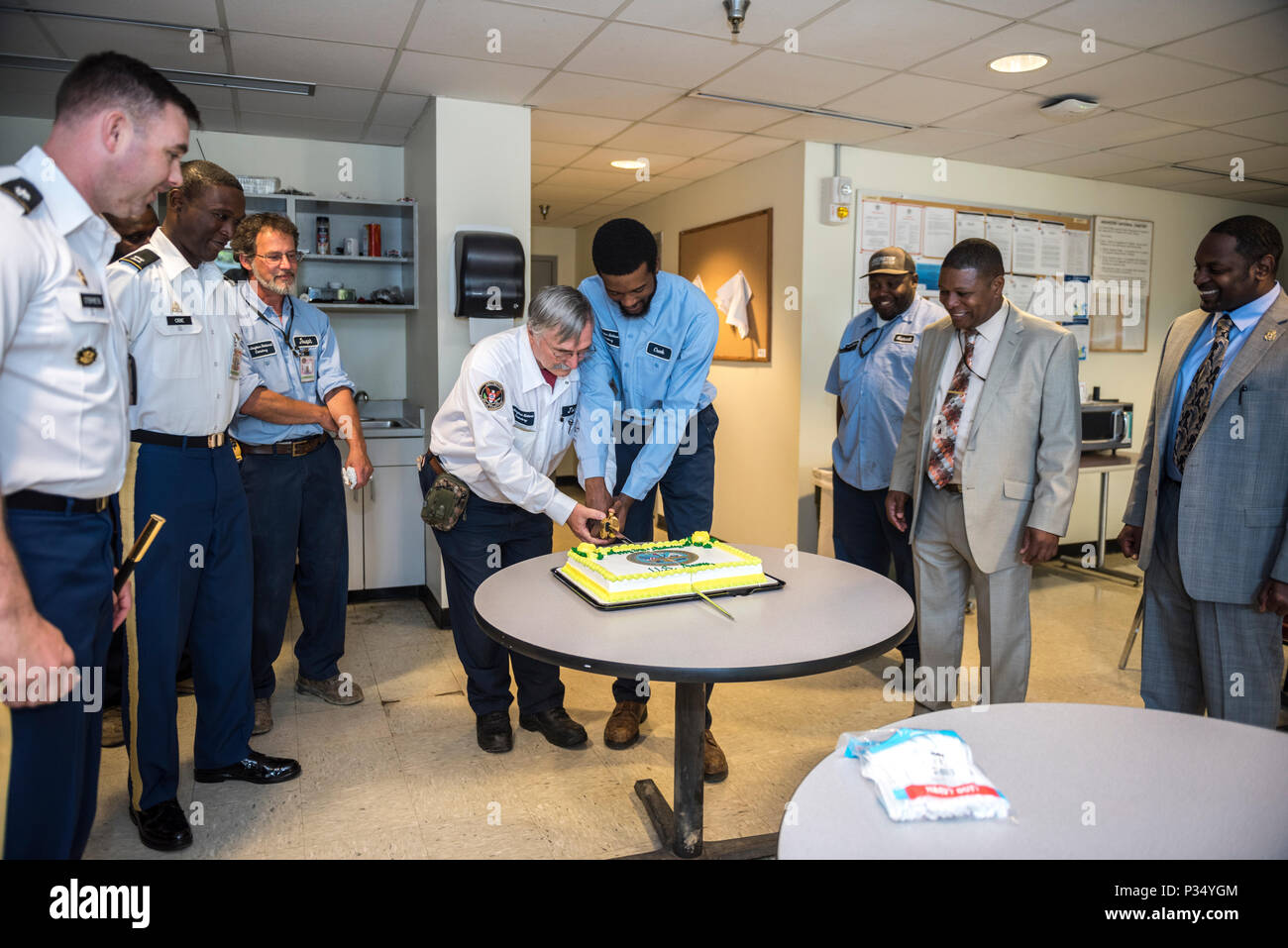 Arlington National Cemetery employees John Gandy (center left) facility ...