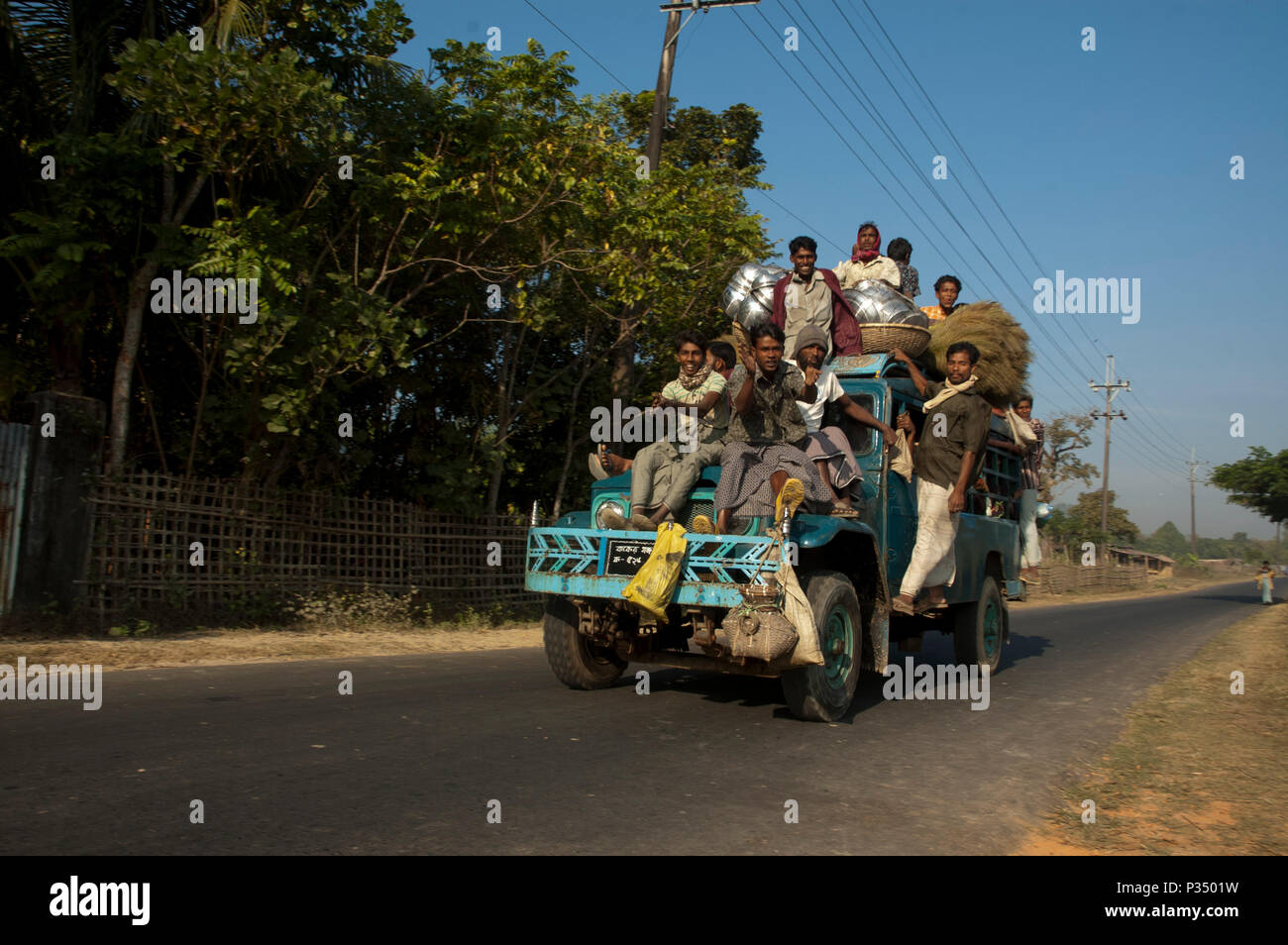 Rural people ride on a Chander Gari at Teknaf in Cox's Bazar district ...