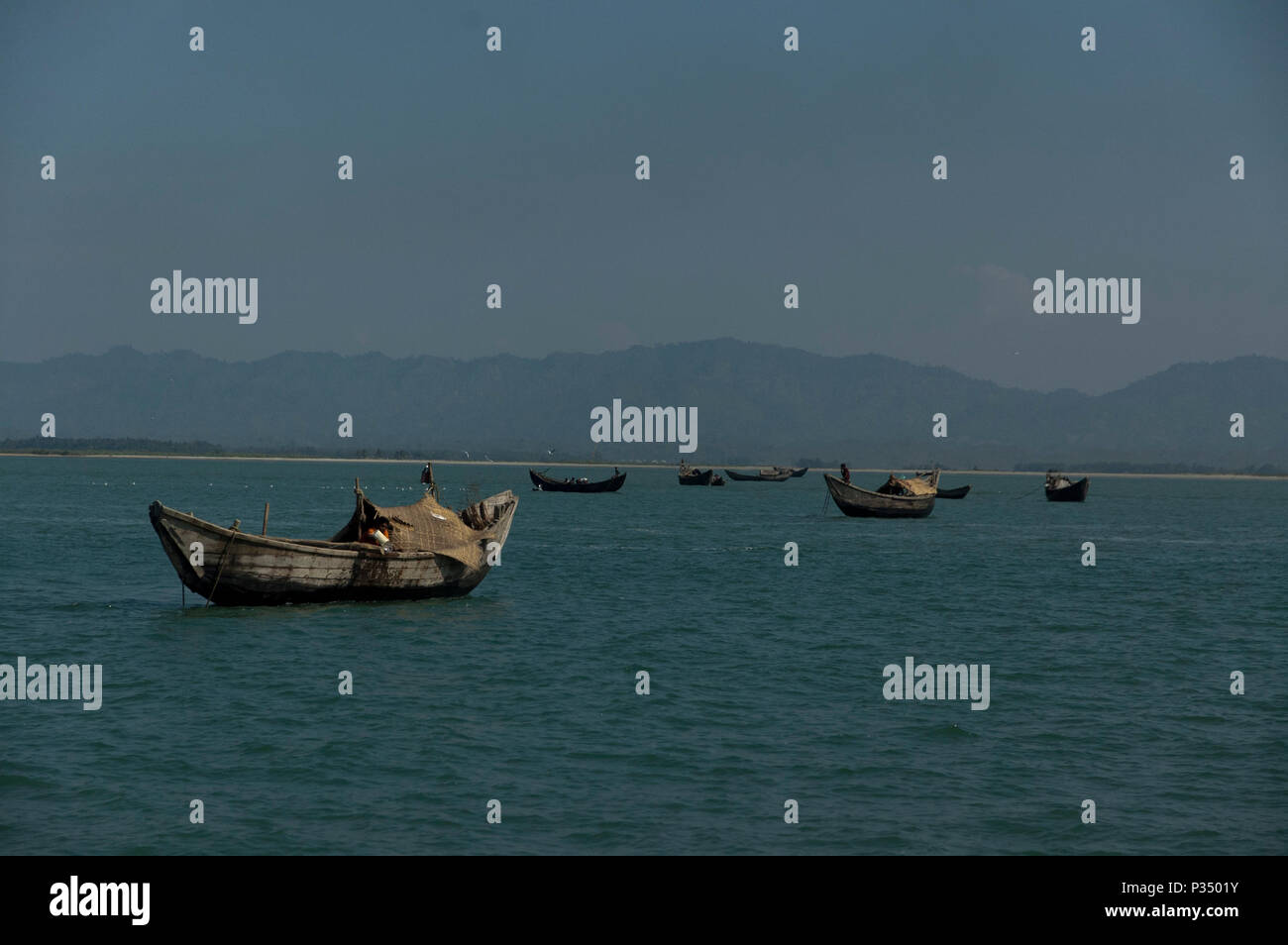 Fishing boats in the Naf River at Teknaf in Cox's Bazar. Naf River an ...