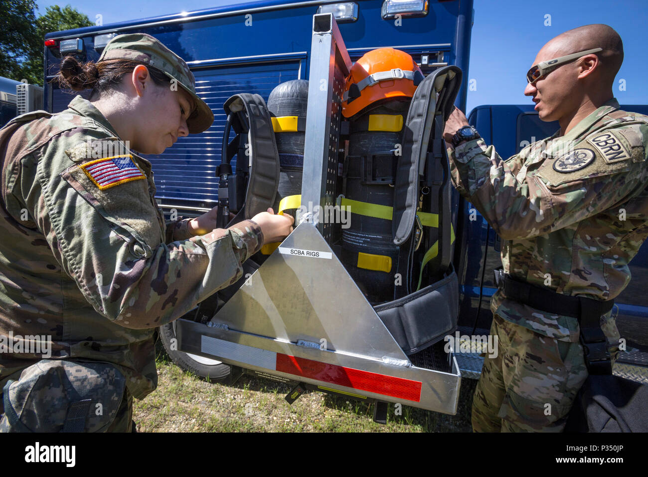 U.S. Army survey team members Sgt. Tricia C. Madrigal, left, and Staff ...