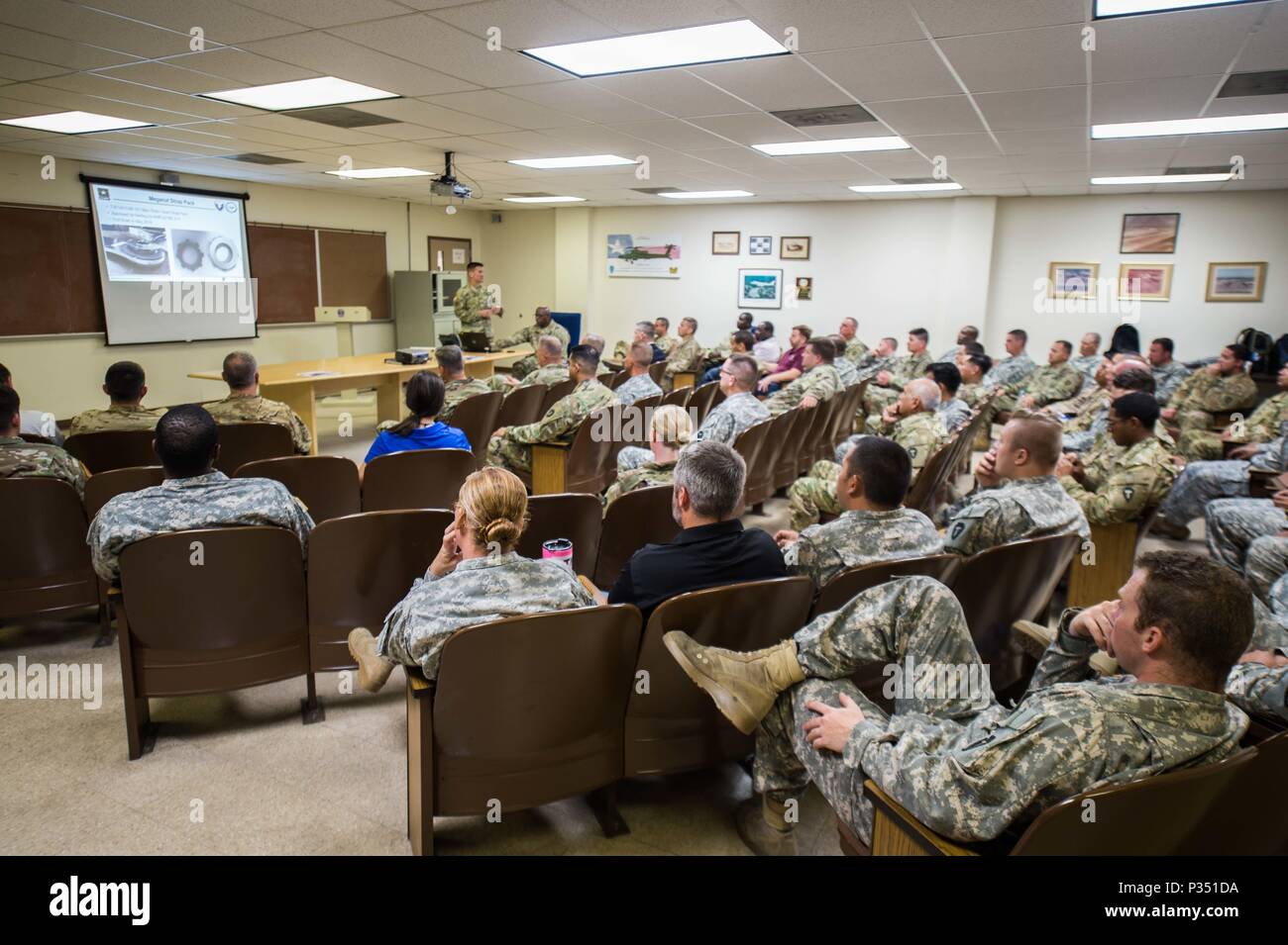 Members of the 1-149th Attack and Reconnaissance Battalion listen to a ...