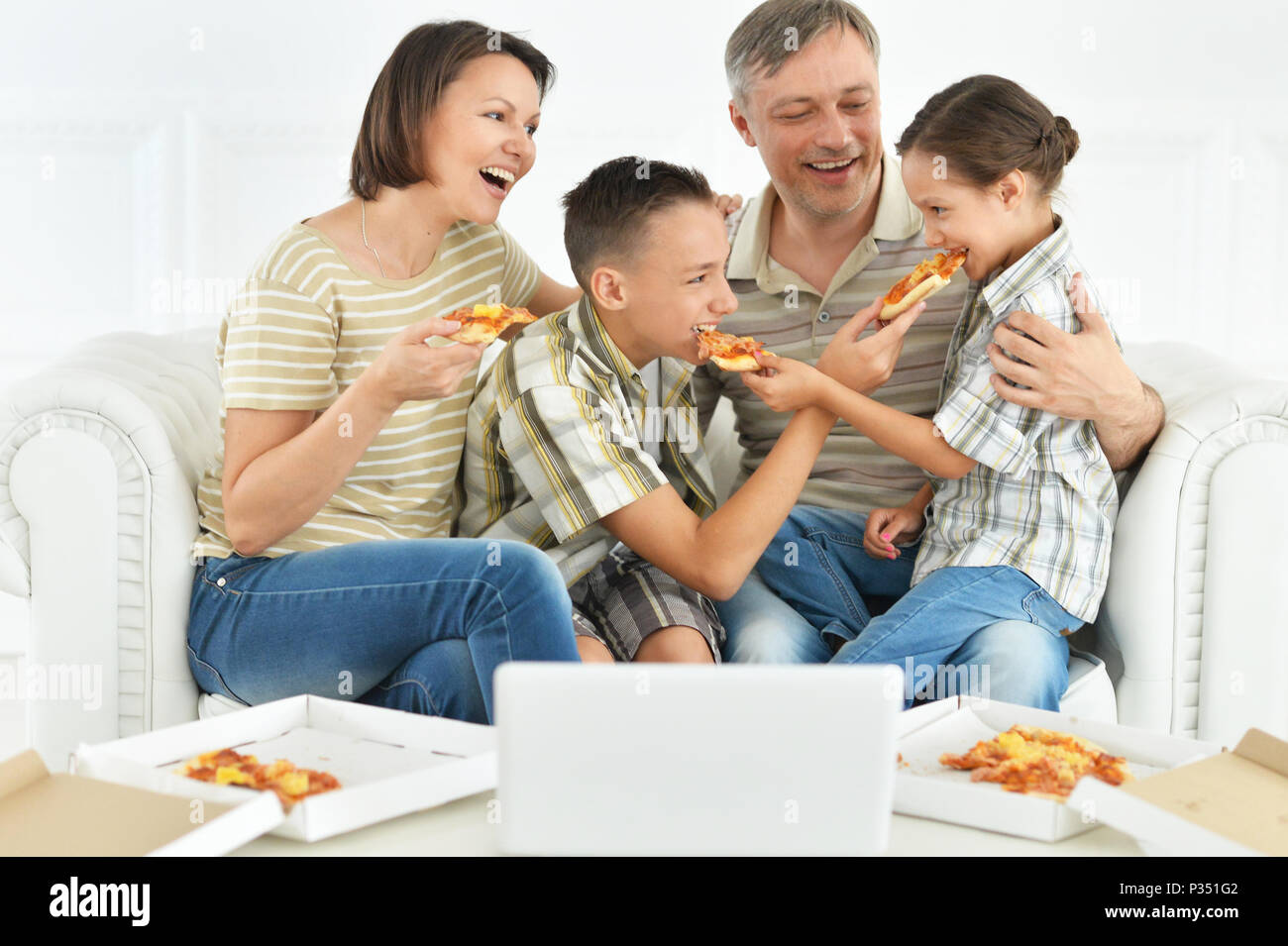 Big family eating pizza hi-res stock photography and images - Alamy