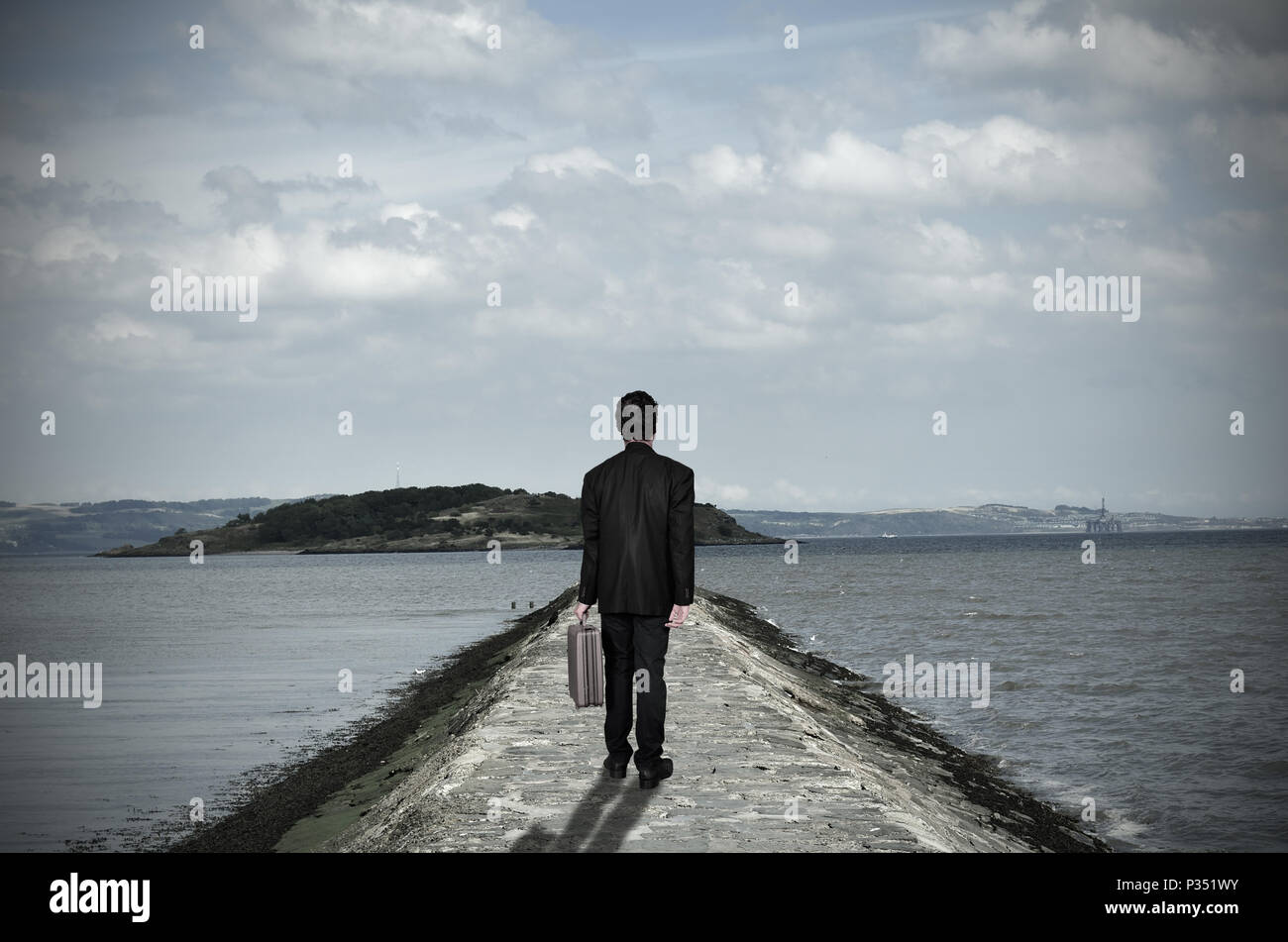 Businessman walking on the pier over sea Stock Photo - Alamy