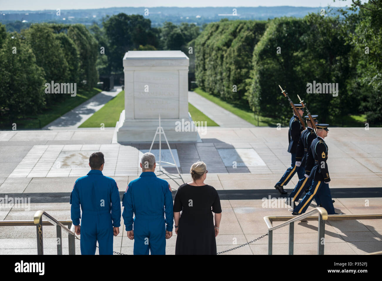 NASA astronauts Joe Acaba (left) and Mark Vande Hei (center) watch the ...