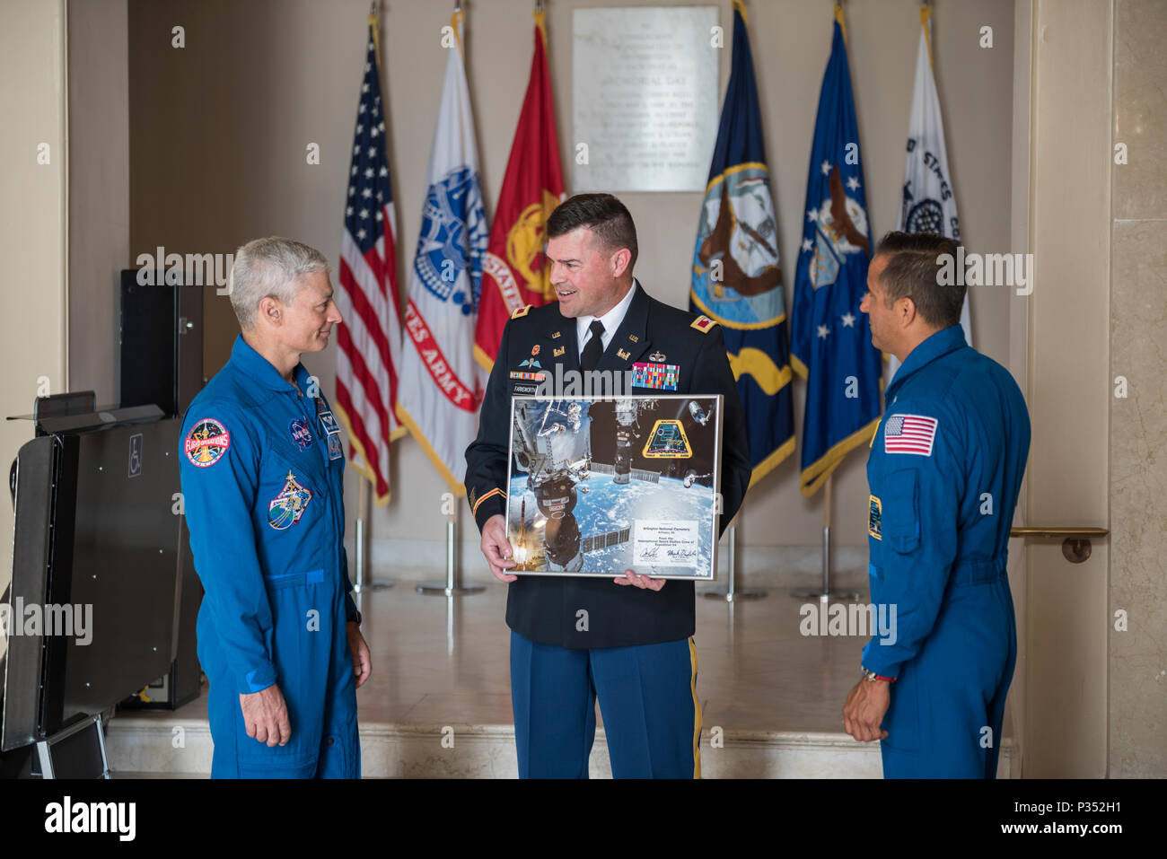 NASA astronauts Mark Vande Hei (left) and Joe Acaba (right) present Col ...